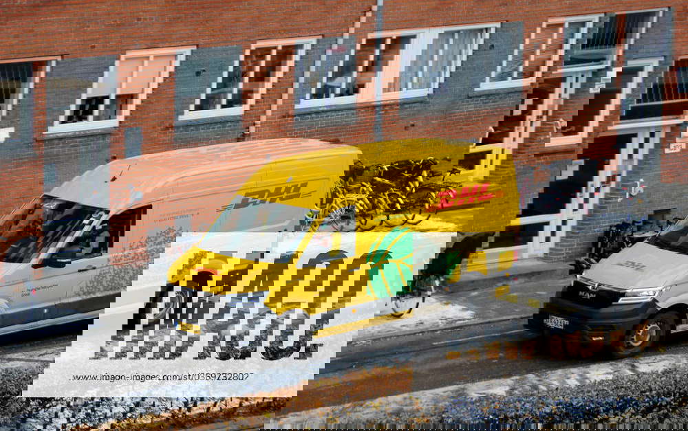 Copenhagen, Denmark 01 December 2023 . Deustche DHL paket delivery ...