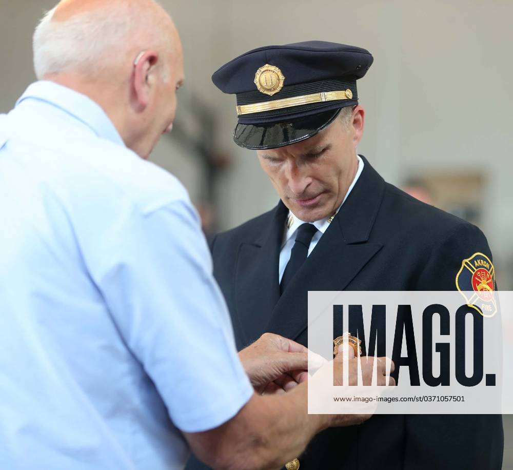 Syndication: Akron Beacon Journal, John Duber, left, presents his son ...