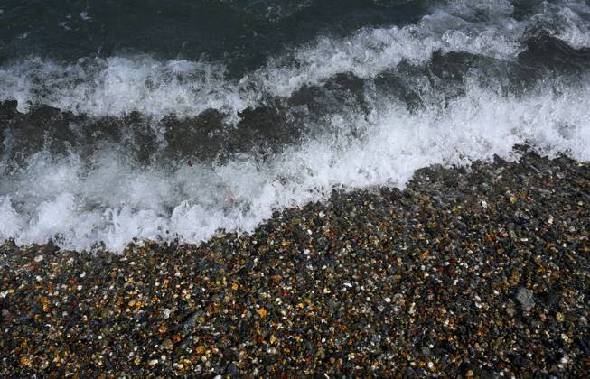 COASTAL STOCK, Stock image of waves washing across pebbles on a beach ...