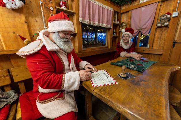 Croatia Santa Clause Zeljko Matagic dressed as Santa Claus gives a ...