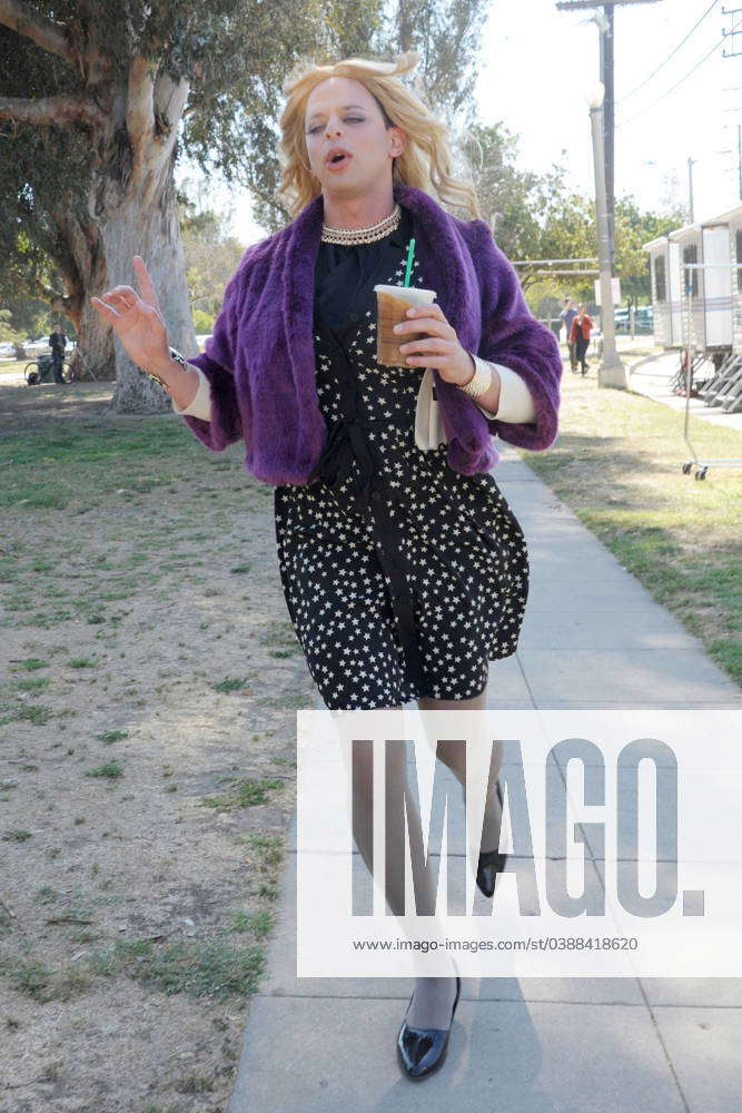 Nick Kroll dressed in a female attire wearing a blond wig seen while ...