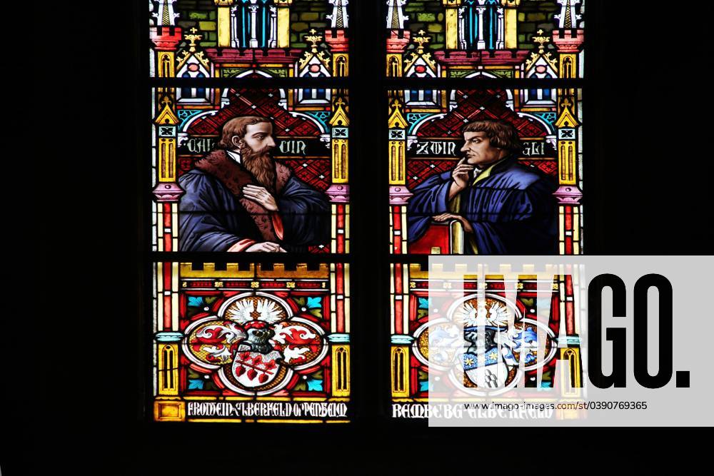 colourful Church window with Reformers John Calvin and Huldrych Zwingli ...