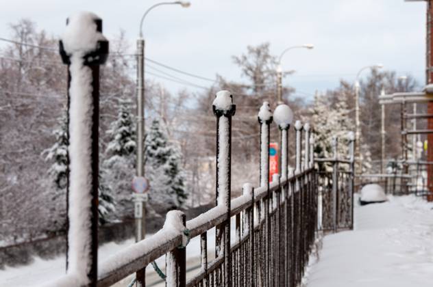 Consequences of snowfall Pedestrian fences covered with snow after a ...
