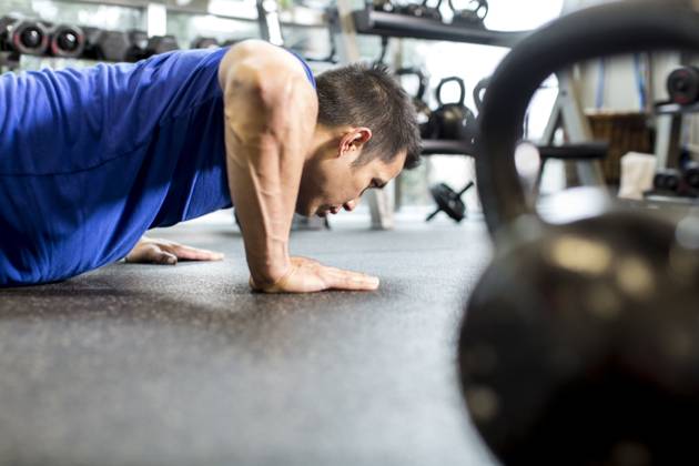 Men, woman and dumbbells in gym workout, training and fitness exercise ...