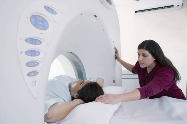 Hispanic nurse comforting patient in MRI machine Valparaiso, Valparaiso ...