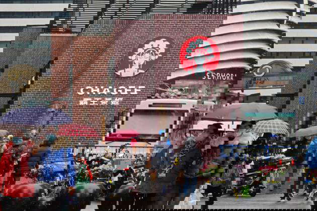 People Walk Past A CHAGEE Store in Shanghai People are walking past a ...