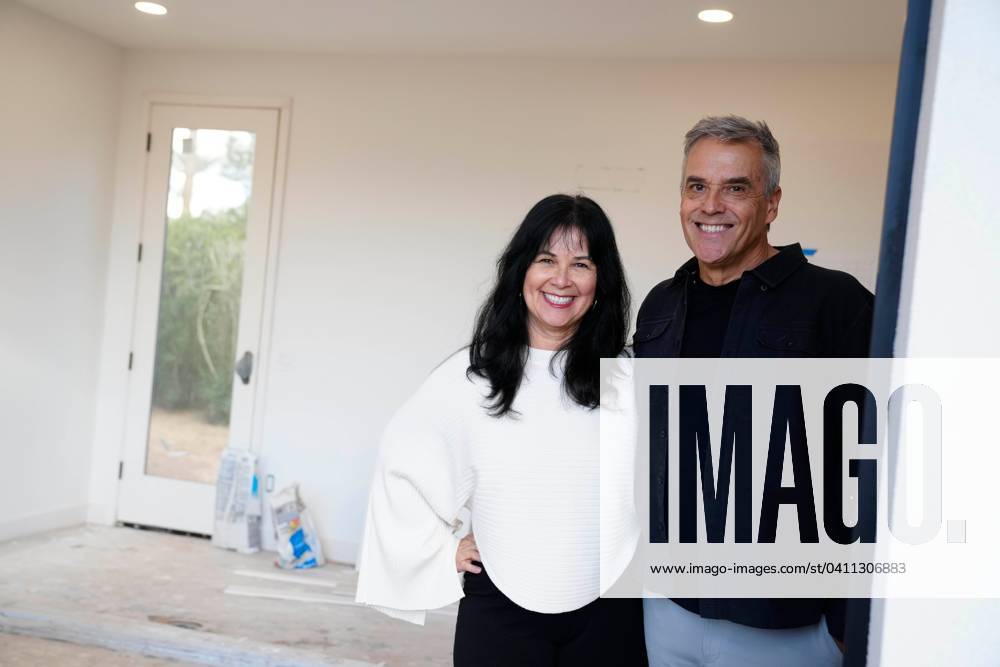 Syndication: Arizona Republic Ted and Genine Telepak stand inside their ...