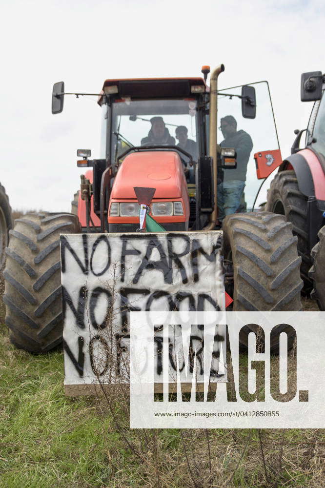 February 9, 2024, Rome, Italy: A tractor hanging a sign reading No farm ...