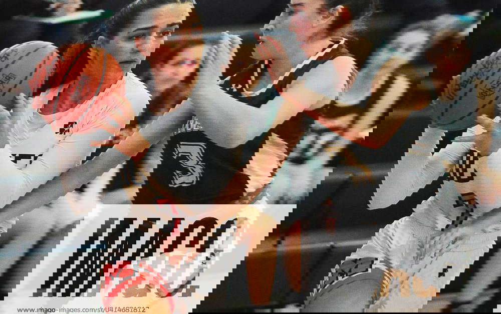 Syndication: Canton Repository Marlington s Zoe Mort is defended by ...