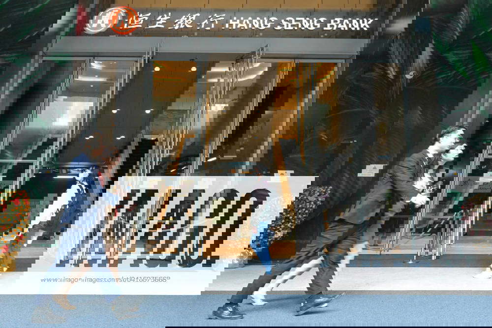 HONG KONG, CHINA - FEBRUARY 21: People walk by the Hang Seng Bank Ltd. headquarters building on