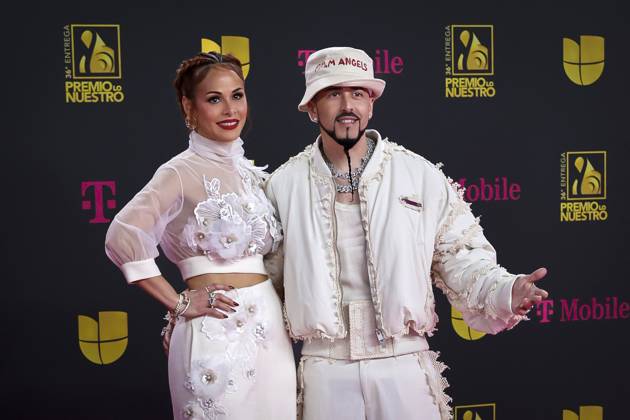 Puerto Rican singer Yandel and his wife Edneris Espada pose on the ...