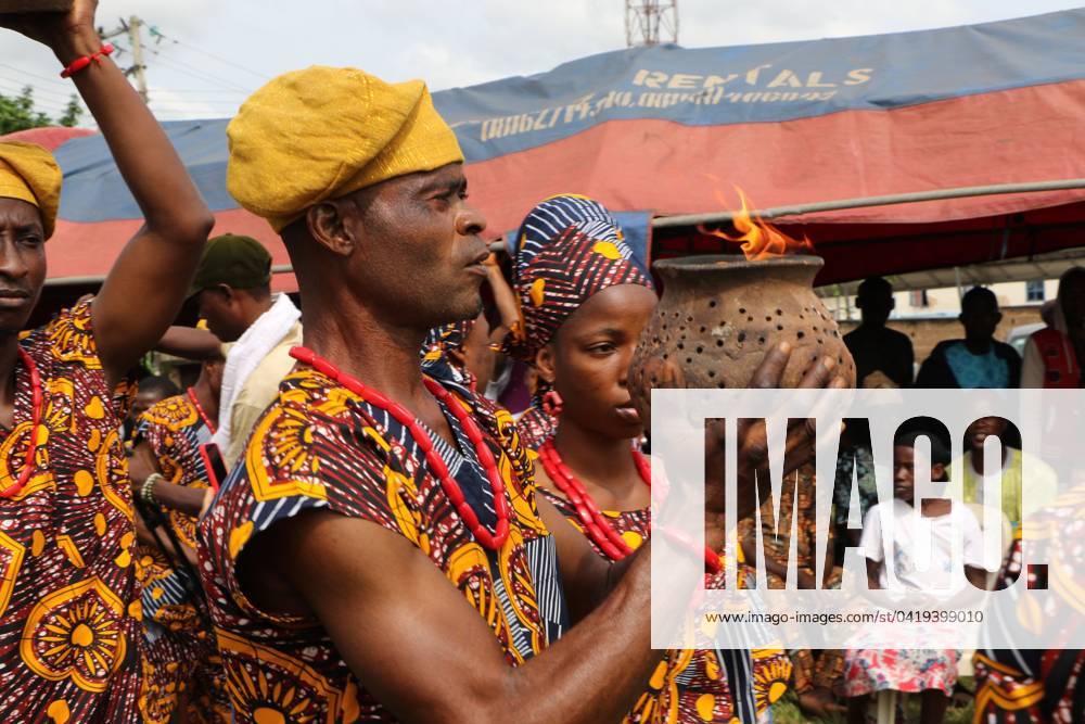Cultural troupe display, a burning fire from a clay pot at the World ...