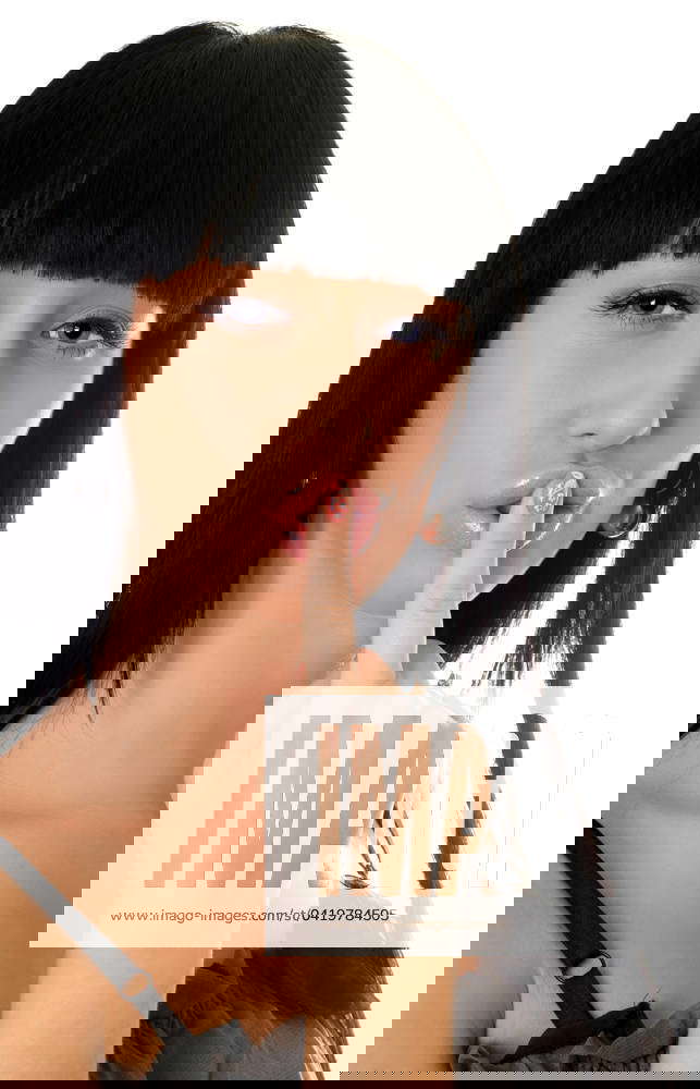 Young woman with a finger at lips Young woman with a finger at lips ...