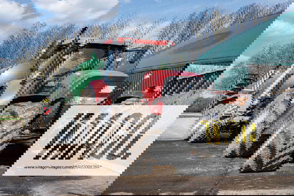 Modern slurry tanker with attached disc harrow removing fermentation ...