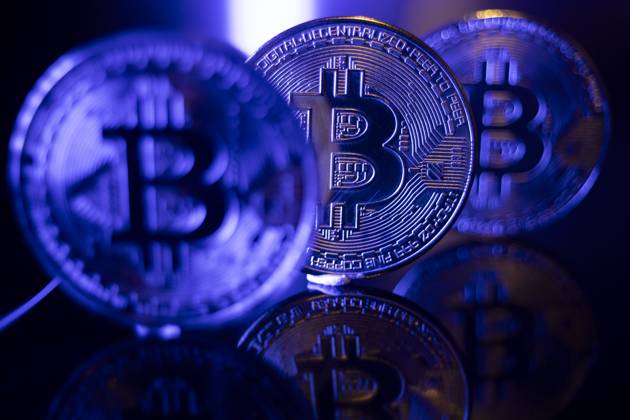 Bitcoin Bitcoins golden physical coin illustration on dark black ...