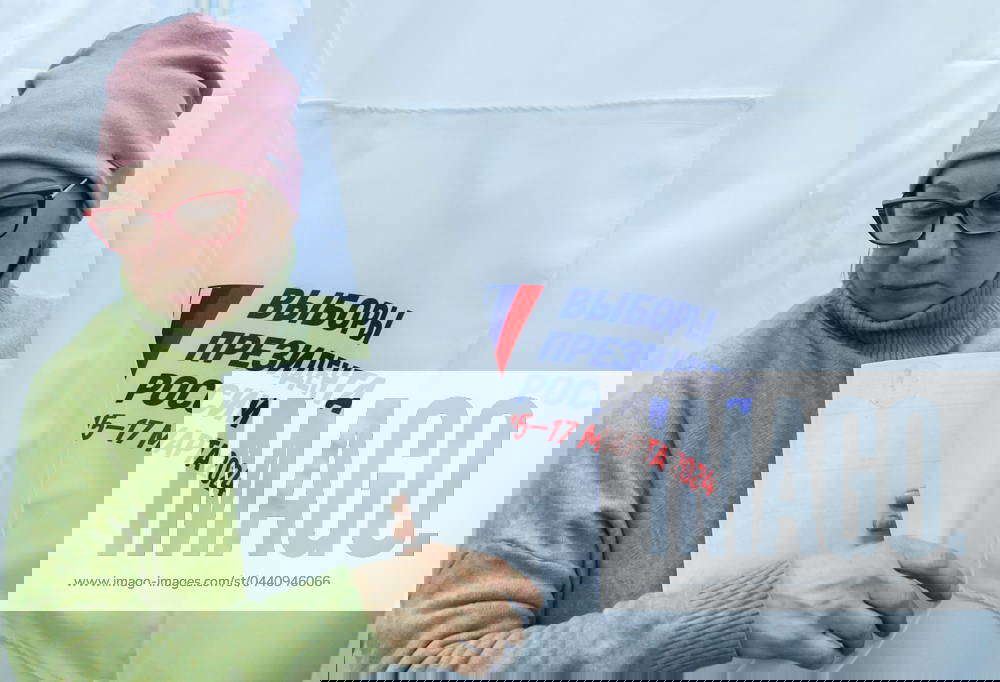 RUSSIA, IVANGOROD - : A woman leaves a voting booth at a polling ...