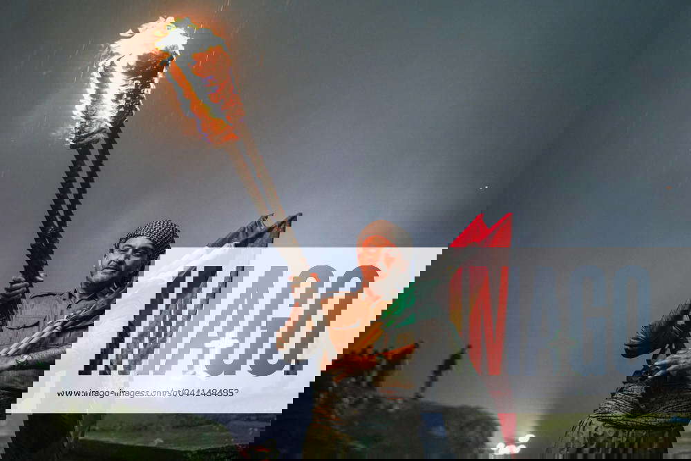 Akre, Dohuk, Iraq: An Iraqi Kurdish man carries a fire torch and ...