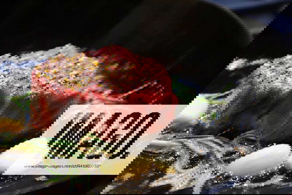 Seasoned raw filet mignon searing in cast iron skillet Fort Wayne ...