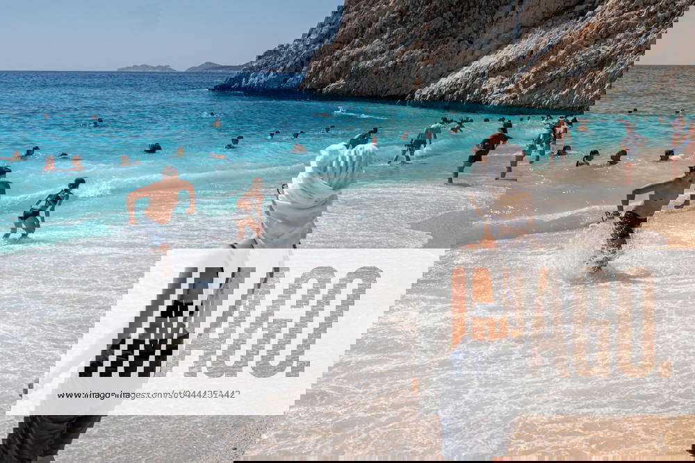 Kaputa? Beach in Antalya, Turkey - 10 Apr 2024 A man runs into the sea ...