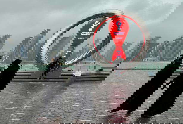 Weather In Doha People are walking along the Doha Corniche with dark ...