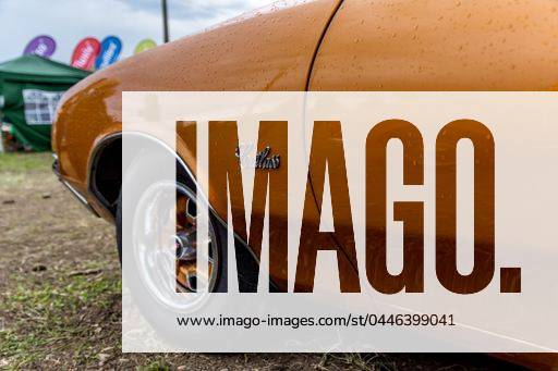 An orange vehicle and signage in the rear in Iasi, Romania 24018709 ...
