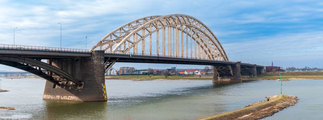 Waal bridge in Nijmegen, Netherlands Arch bridge over the Waal river at ...