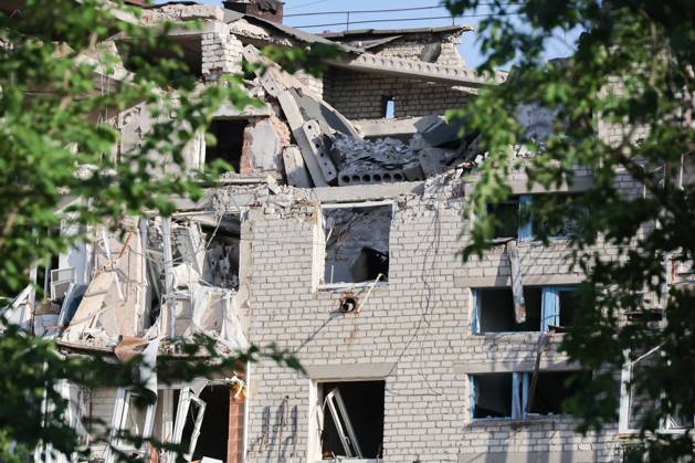 RUSSIA, TOKMAK - : A view of an apartment block damaged in a military ...