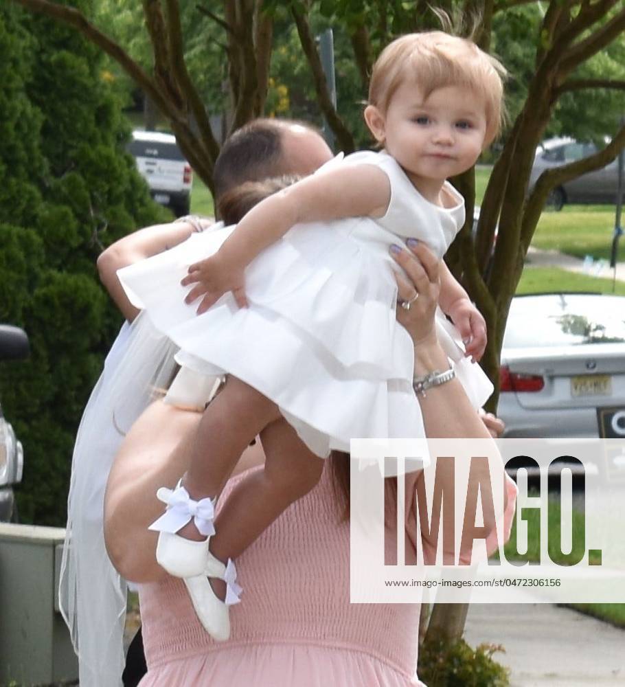 Syndication: Courier-Post A wedding guest lifts 14-month-old Amelea ...