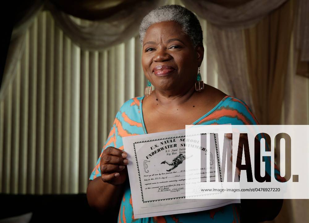 Syndication: Florida Times-Union Cynthia Byrd Connor holds a copy of ...