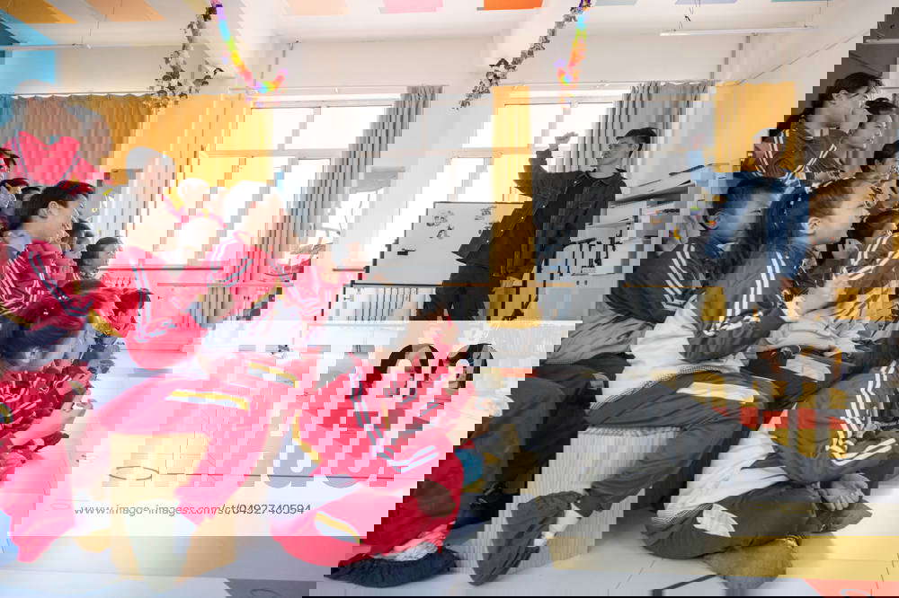 HARBIN, Teacher Li Ping teaches children in the music class at the ...