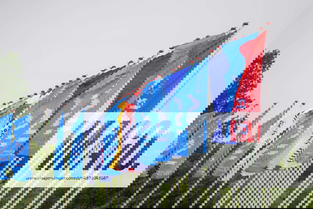 Colorful flags of the ILA and BER, Messe Berlin blowing in the wind ...