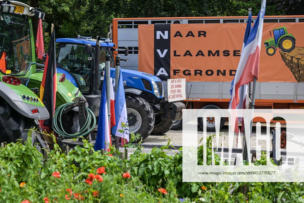 Signs are seen on tractors during a protest action of various European ...