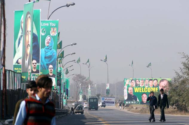 PESHAWAR, PAKISTAN, FEB 03: Greeting banners and flags of Muslim League ...