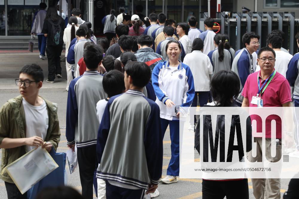 BEIJING, CHINA - JUNE 07: Students queue up to enter an exam venue of ...