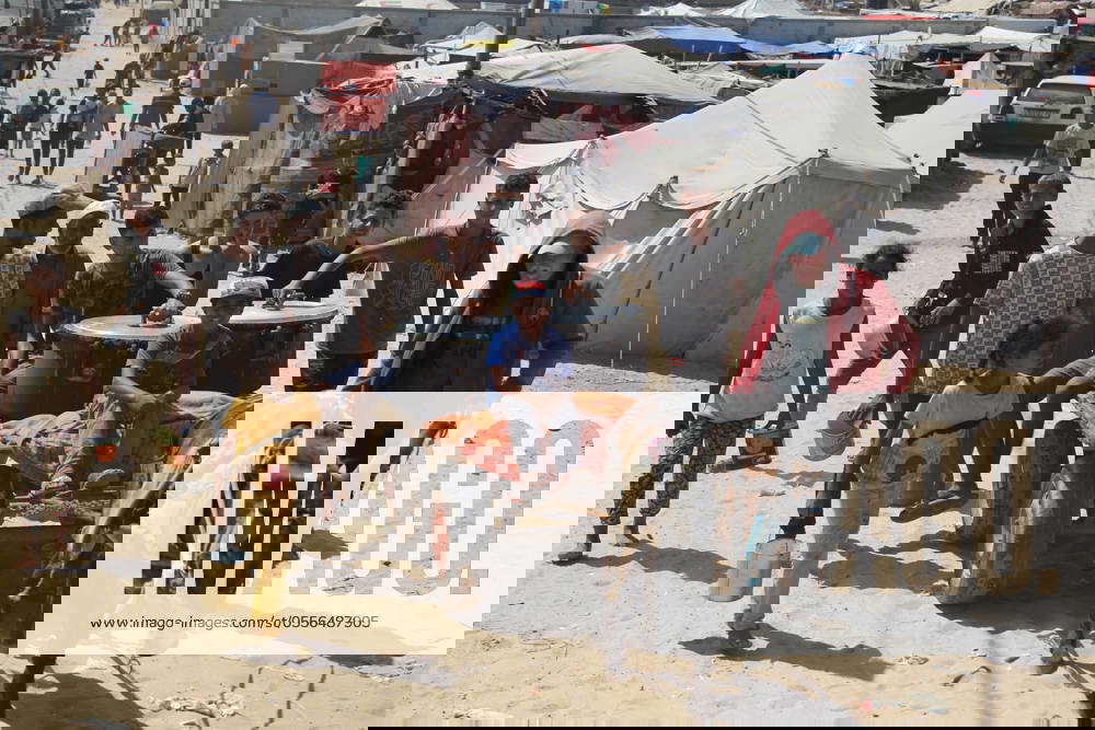 GAZA, People receive food relief in the southern Gaza Strip city of ...