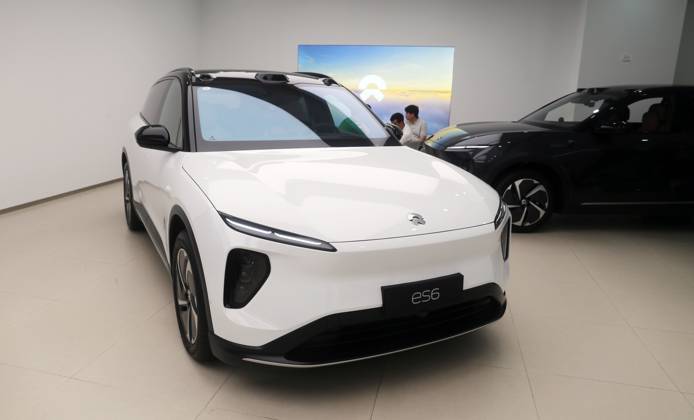 NIO Store in Shanghai SHANGHAI, CHINA - Customers experience new energy ...