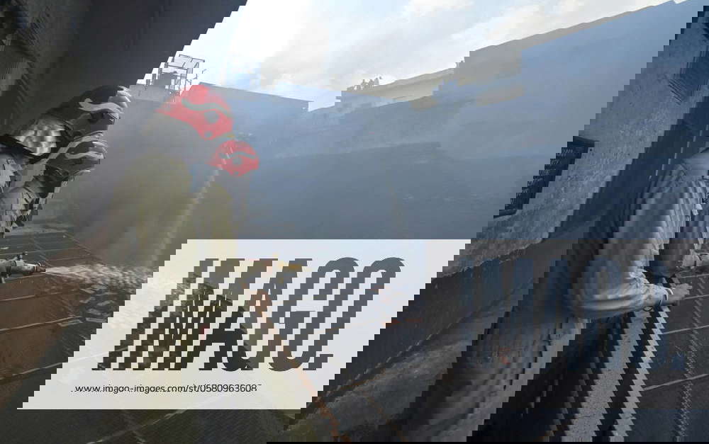 NEW DELHI, INDIA - JUNE 14: Firefighters seen during cooling off ...