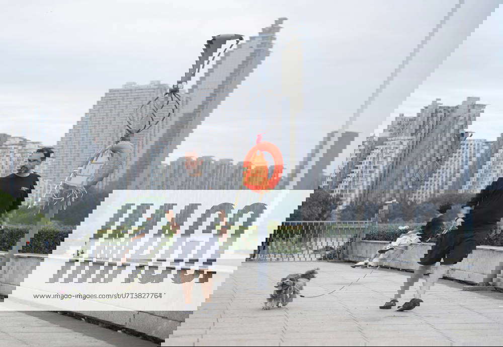 (240720) -- WUHU, July 20, 2024 -- Gabriel Martin walks his dog along ...