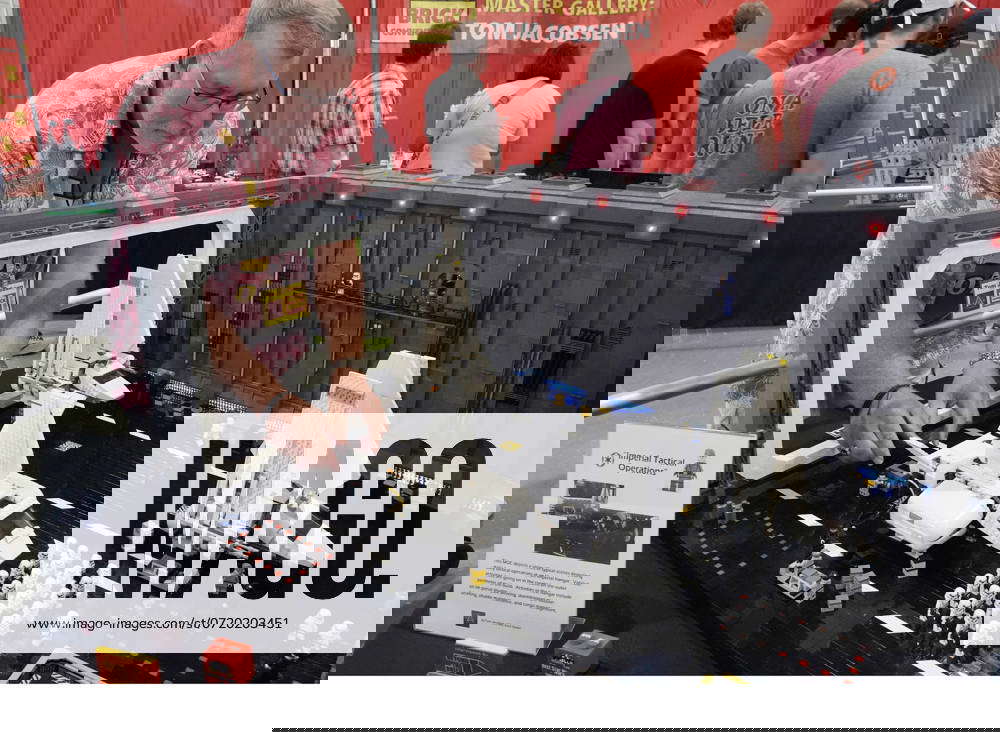 Lego master architect Tom Jacobsen adjusts pieces of his creation of ...