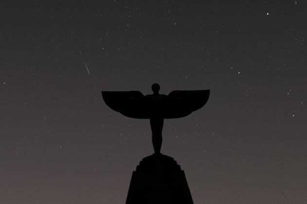 Berlin, Germany: Meteors from the Perseids meteor shower fall behind a ...
