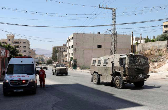 TUBAS, Aug. 14, 2024 -- Israeli military vehicles are seen during an ...