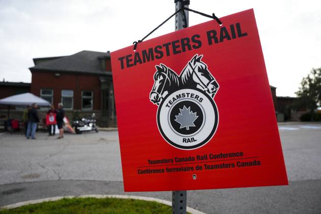 Smiths Falls, Ontario, Canada: Teamsters Rail placards sit in a pile at ...