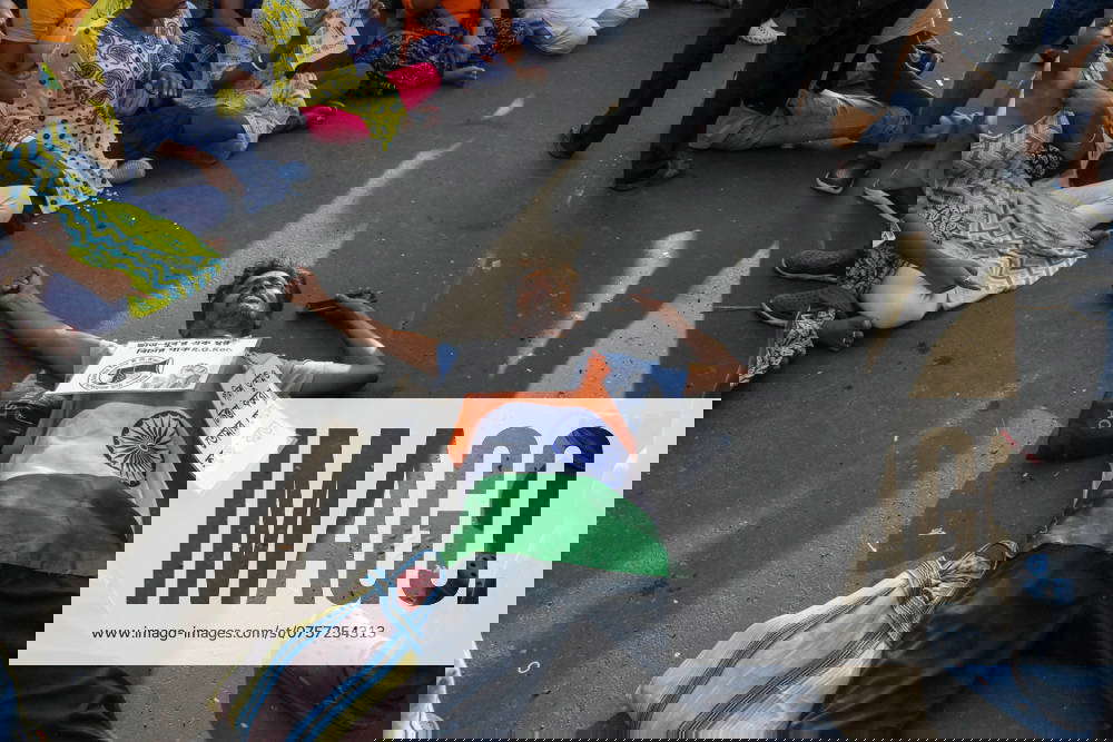 Students Society Protest In India A protestor lies on the street during ...