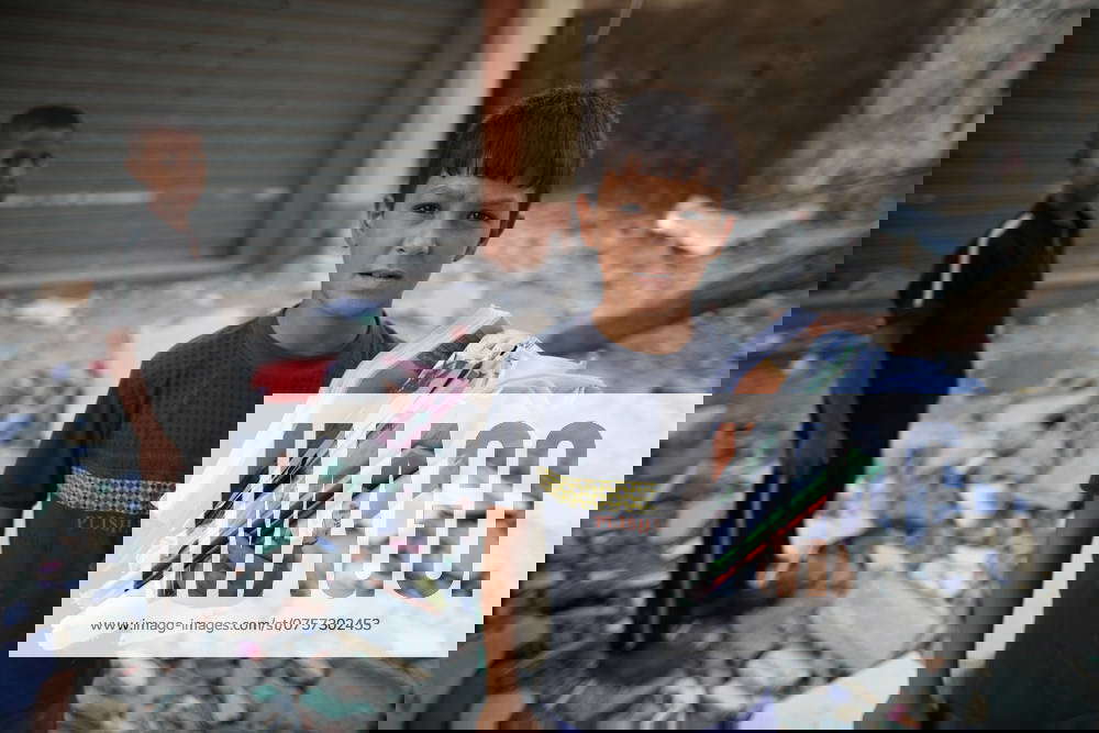 MAGHAZI REFUGEE CAMP, Aug. 27, 2024 -- Children are seen outside a ...