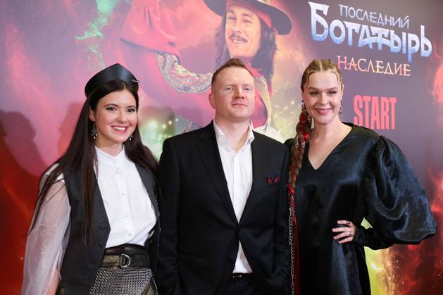 RUSSIA, MOSCOW - : Film director Anton Maslov poses with actresses Evelina Mazurina and Arina