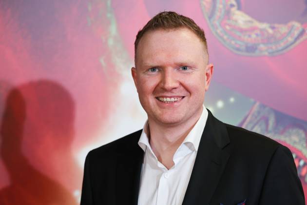 RUSSIA, MOSCOW - : Film director Anton Maslov poses with actresses Evelina Mazurina and Arina