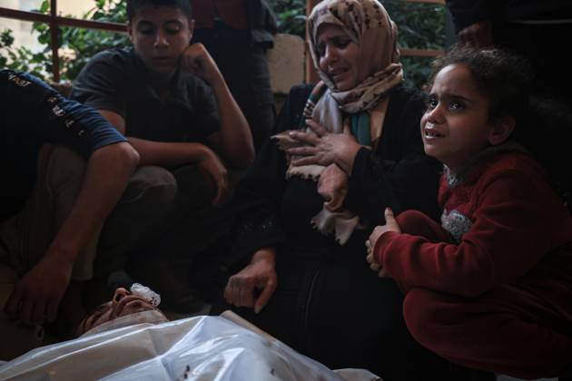 Gaza, Gaza, Palestine: Palestinians cry in front of the bodies of their ...