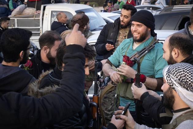 Damascus, Syria: A local man poses for a picture while holding a rose ...
