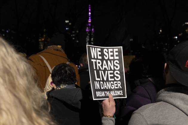 February 9, 2025, New York, New York, USA: A demonstrator holds a sign that reads DEFEND THE