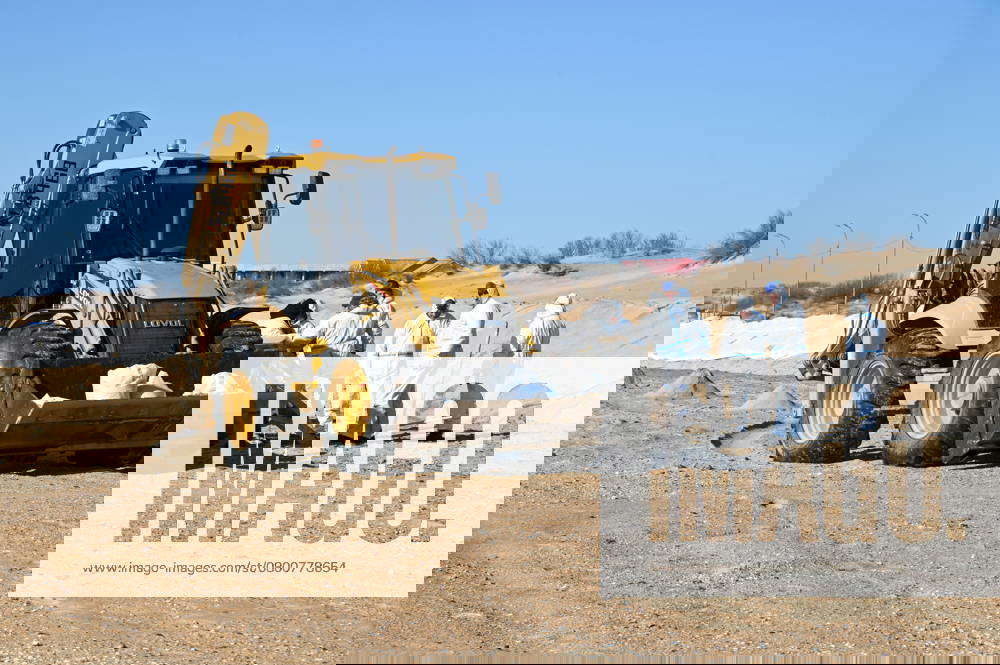 RUSSIA, ANAPA - : Volunteers sift sand during an oil spill clean-up ...